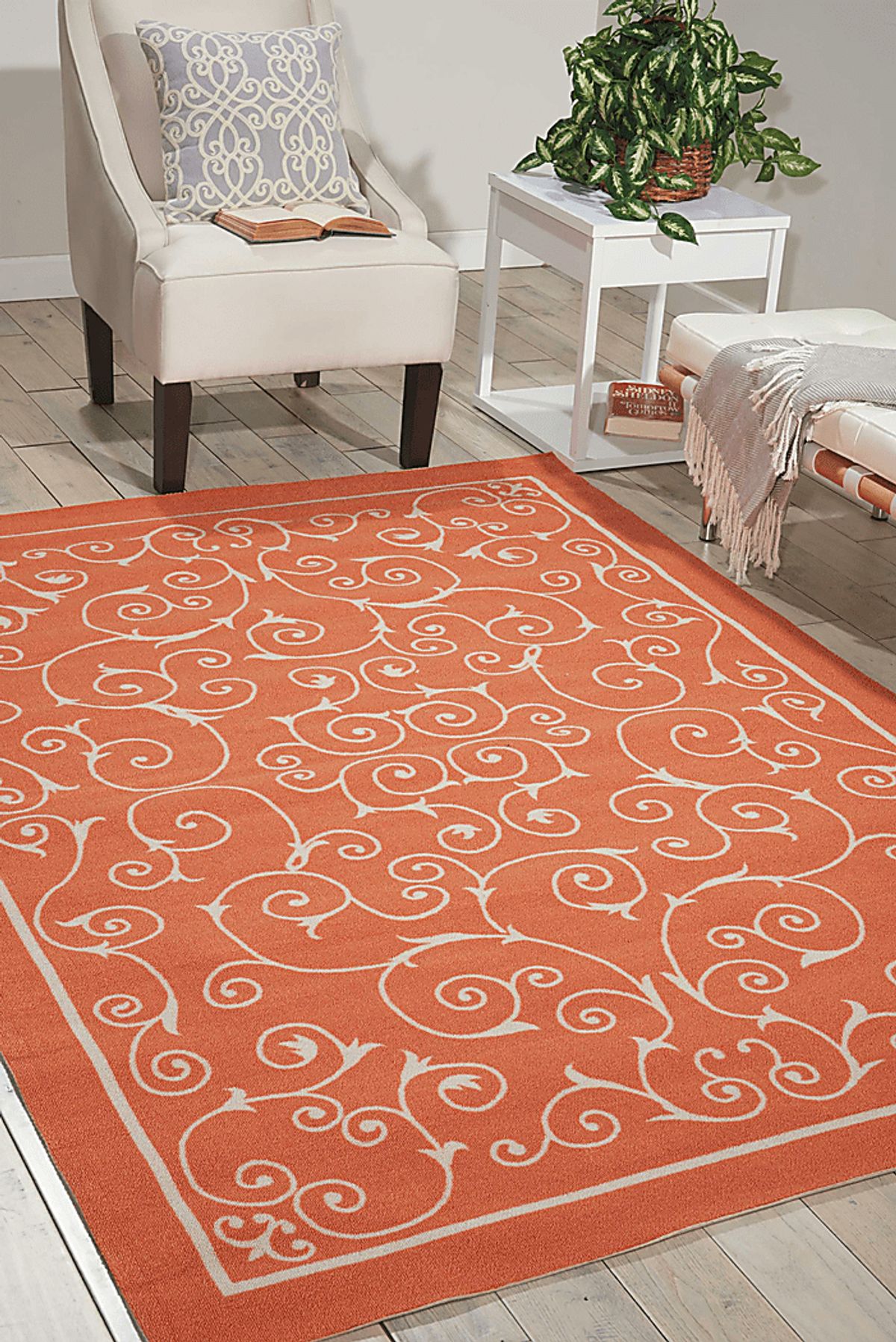 Althera Orange Orange,Red Polyester Fabric Outdoor Rug | Rooms to Go