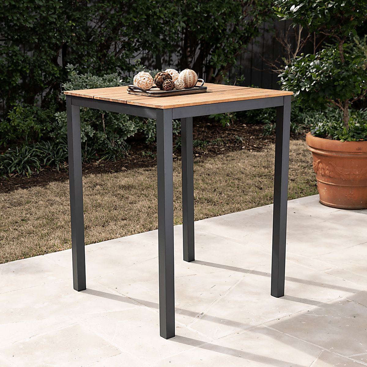 Brasher Brown Dark Wood Outdoor Bar Height Table | Rooms to Go
