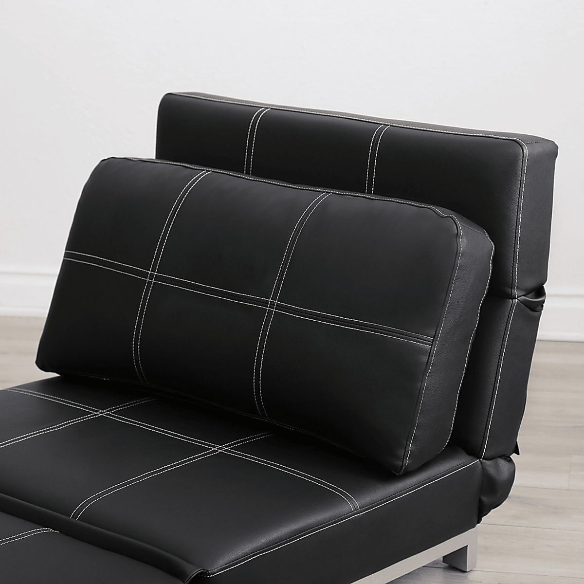 Cheever Black Polyurethane Fabric Futon Chair | Rooms to Go