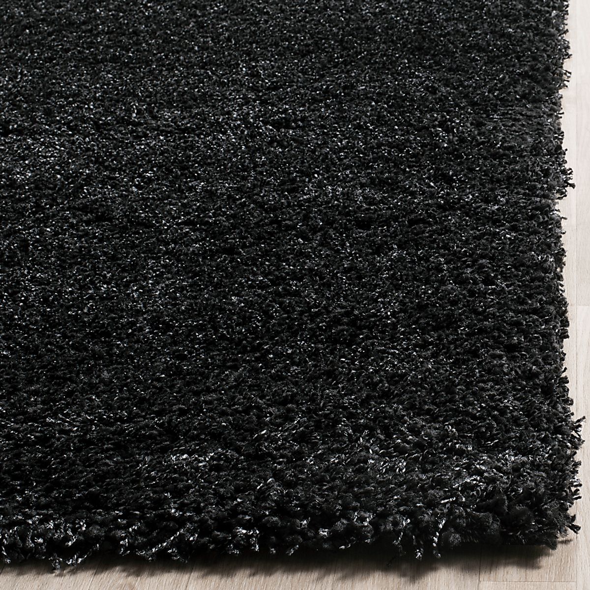 Cleona Black Polypropylene Fabric Rug | Rooms to Go