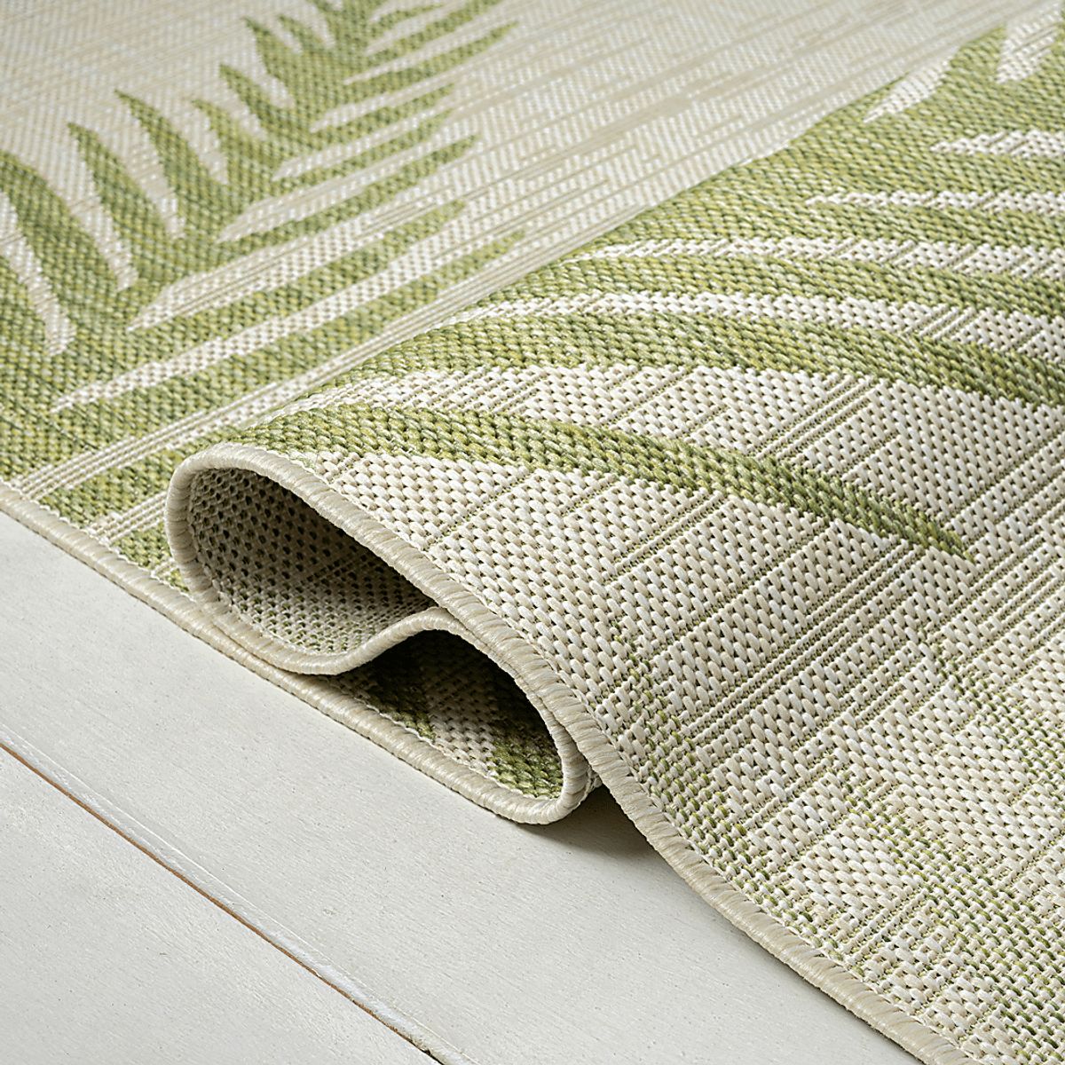 Derall Green Outdoor Rug | Rooms to Go