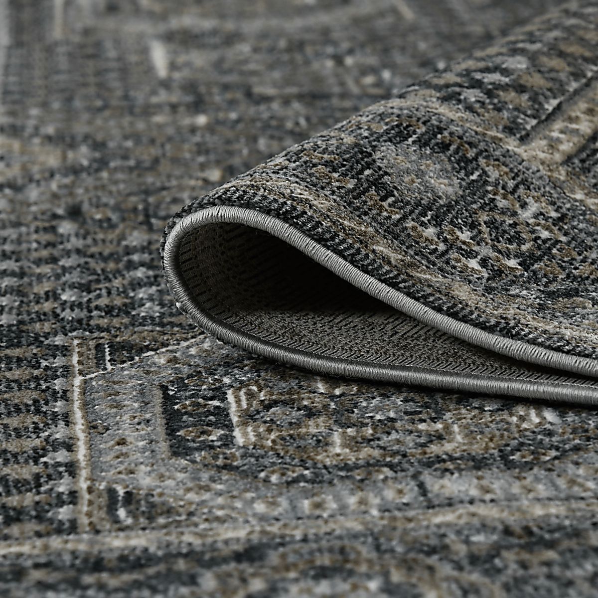 Haertley Charcoal Black,Gray Rugs | Rooms to Go