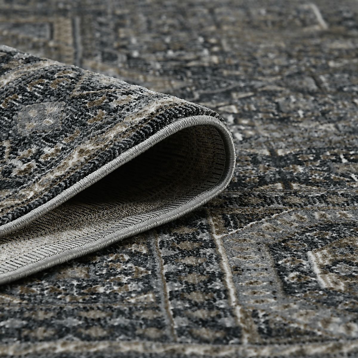 Haertley Charcoal Black,Gray Rugs | Rooms to Go