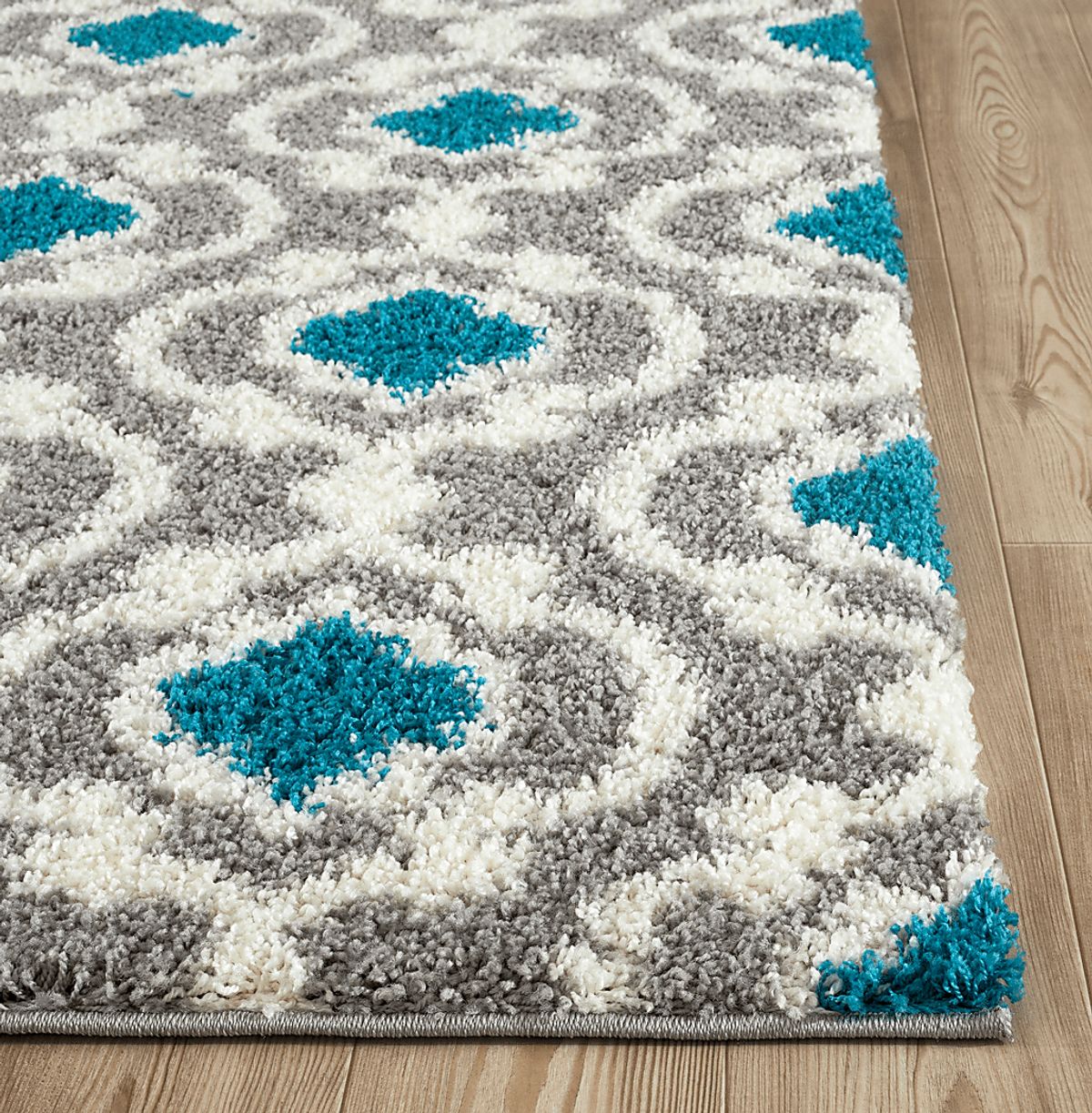 Irenee Turquoise Blue Rug | Rooms to Go
