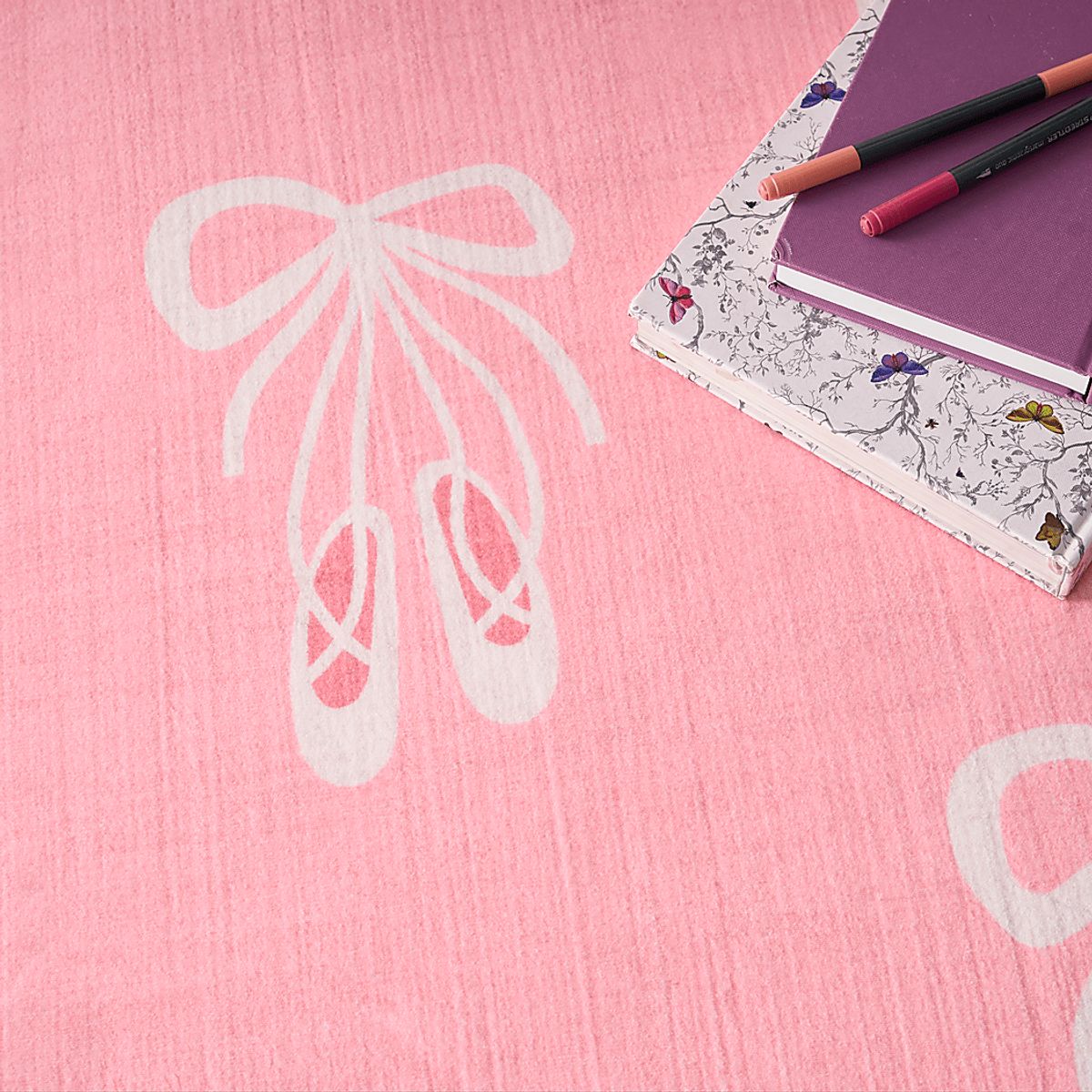 Demure Bow Pink Rugs | Rooms to Go