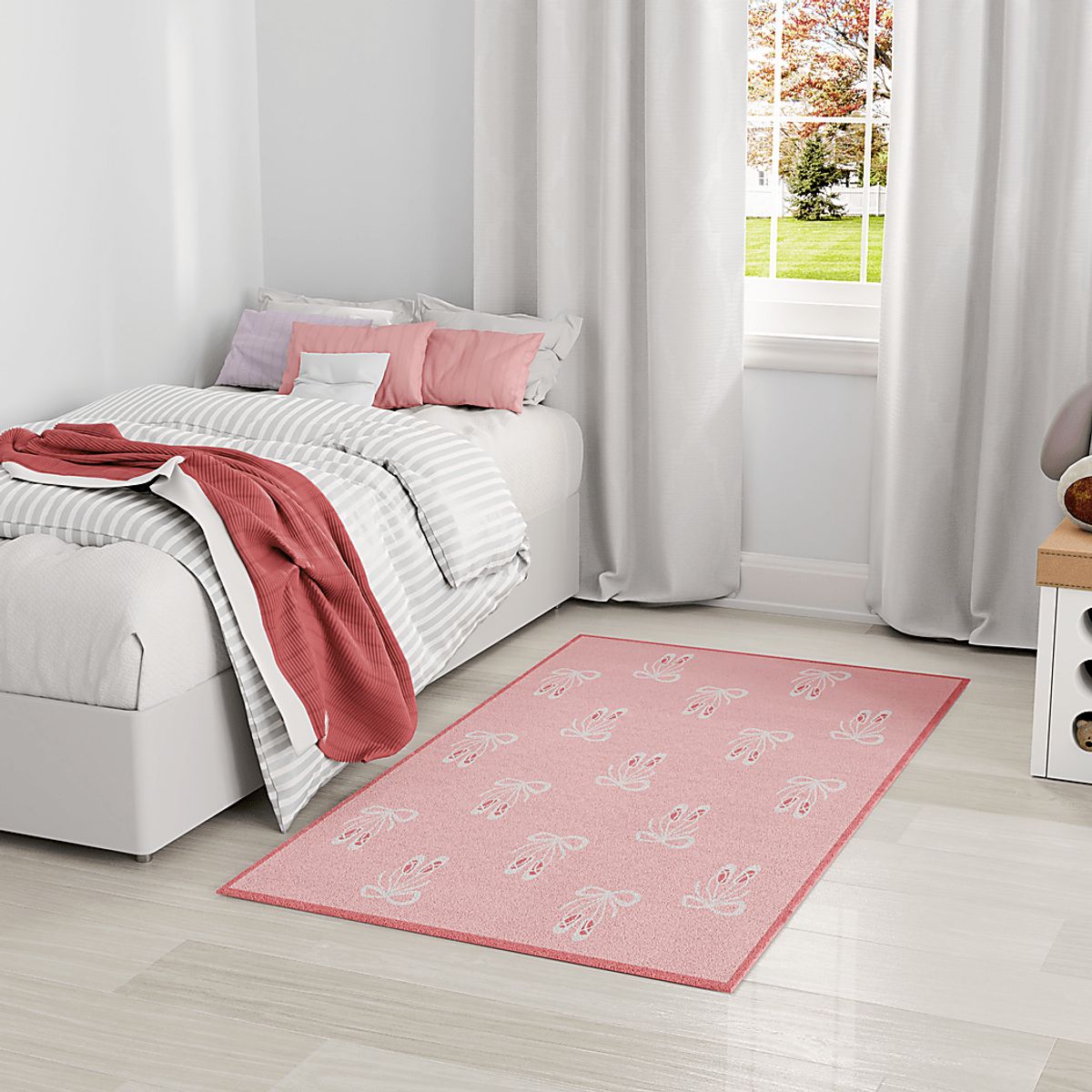 Demure Bow Pink Rugs | Rooms to Go