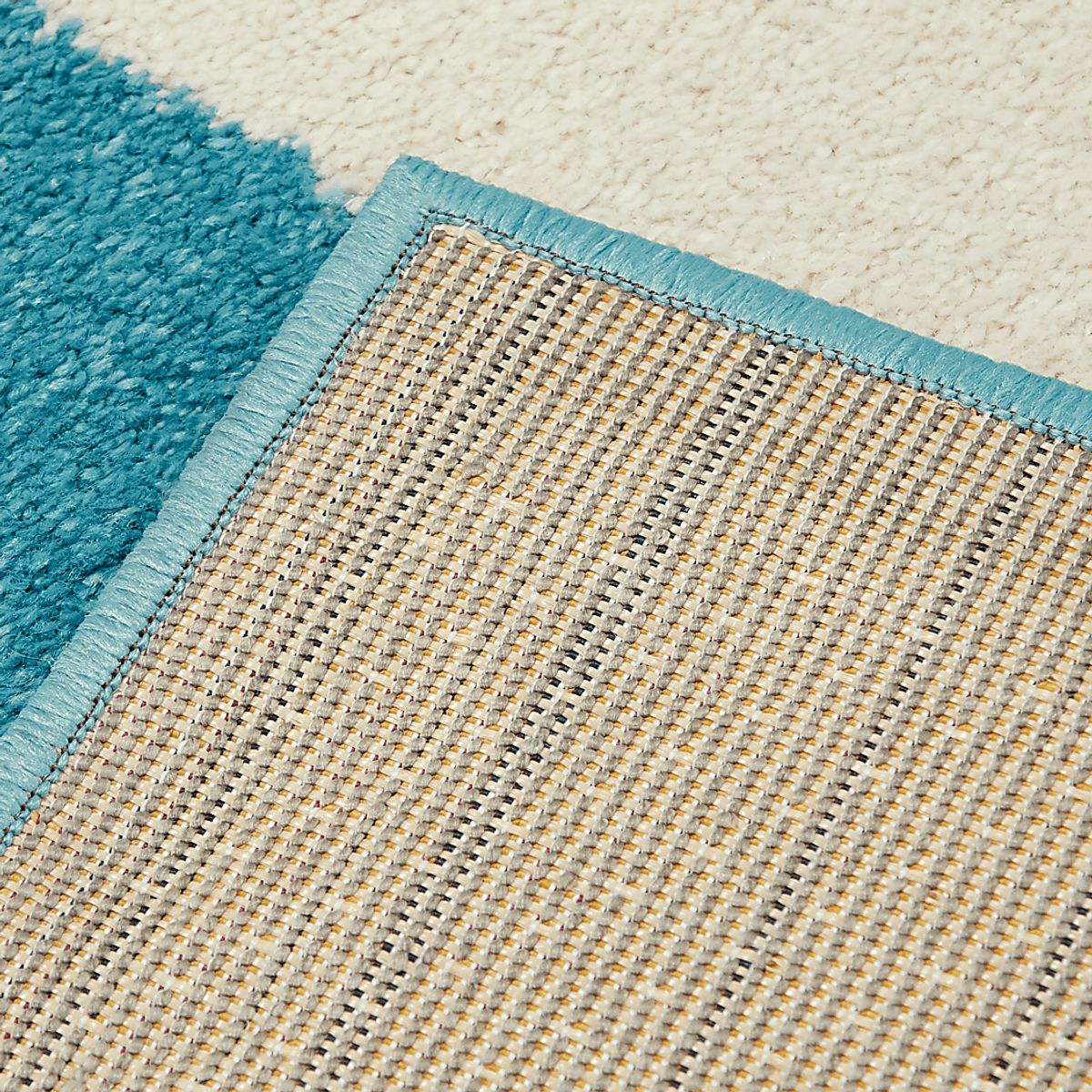 Wild Angles Blue Polypropylene Fabric Rug | Rooms to Go