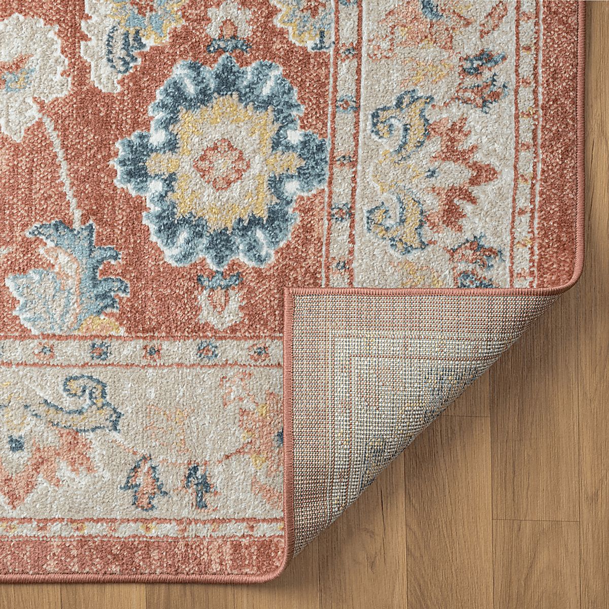 Manu Ivory,Rust Beige,Red Rugs | Rooms to Go