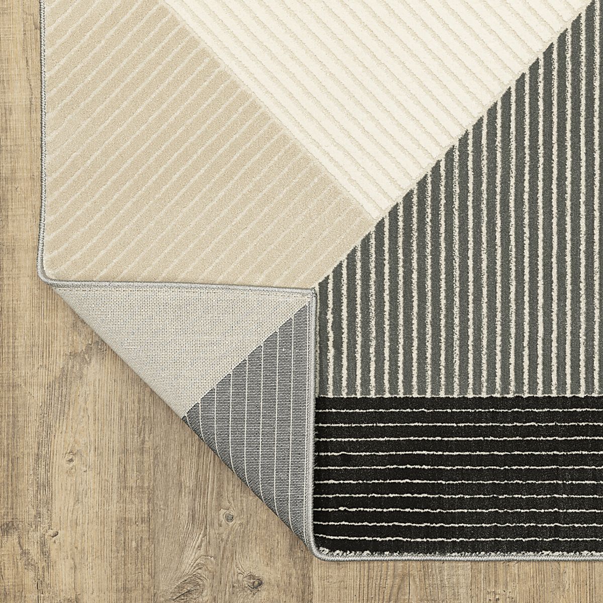 Merien Black,Ivory Beige,Black Rugs | Rooms to Go