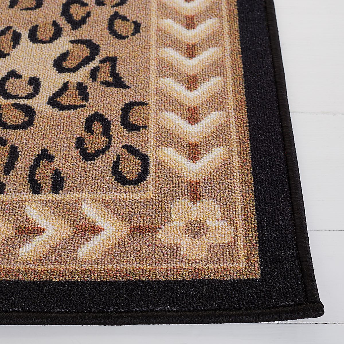 Oguvo Beige,Black Rugs | Rooms to Go
