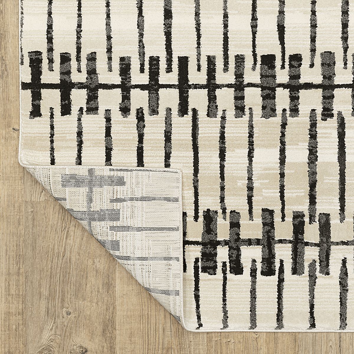 Ritho Black,Ivory Beige,Black Rugs | Rooms to Go