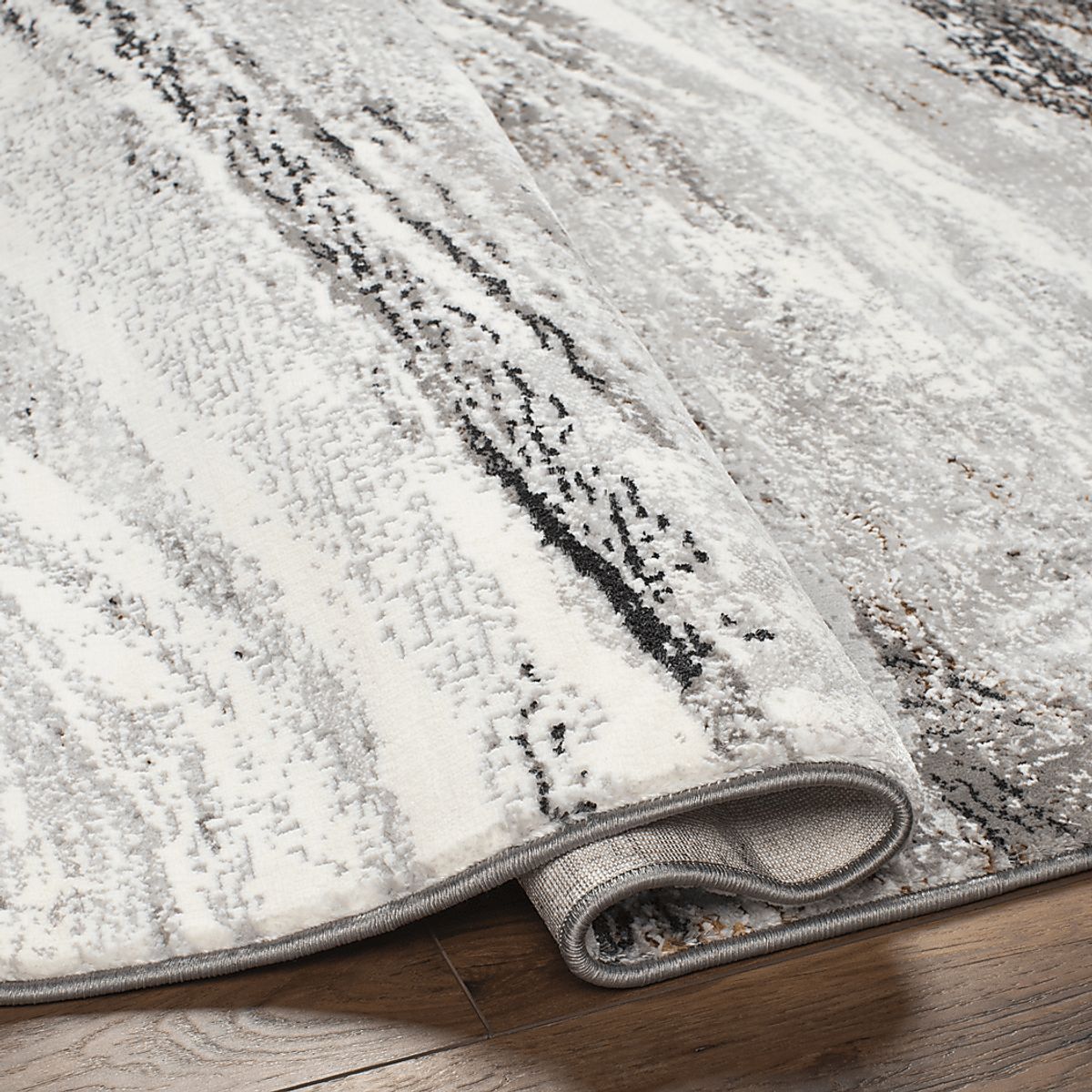 Sotihi Black,Charcoal,Ivory,Light Gray Beige,Black,Gray Rugs | Rooms to Go