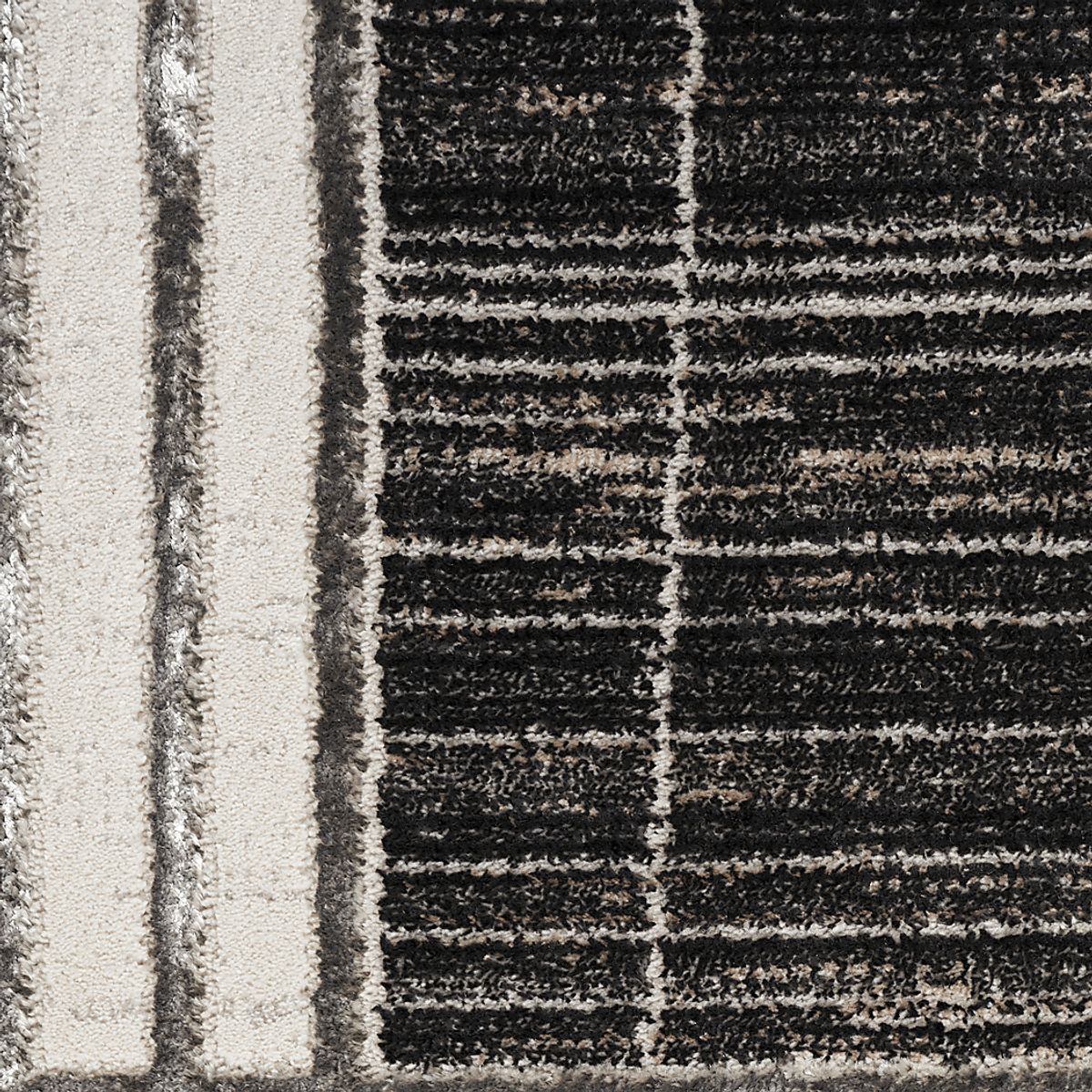 Susson Charcoal Black,Gray Rugs | Rooms to Go