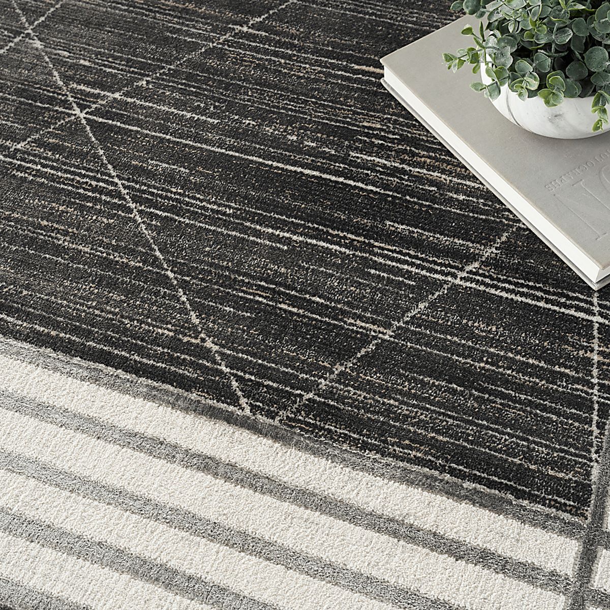 Susson Charcoal Black,Gray Rugs | Rooms to Go