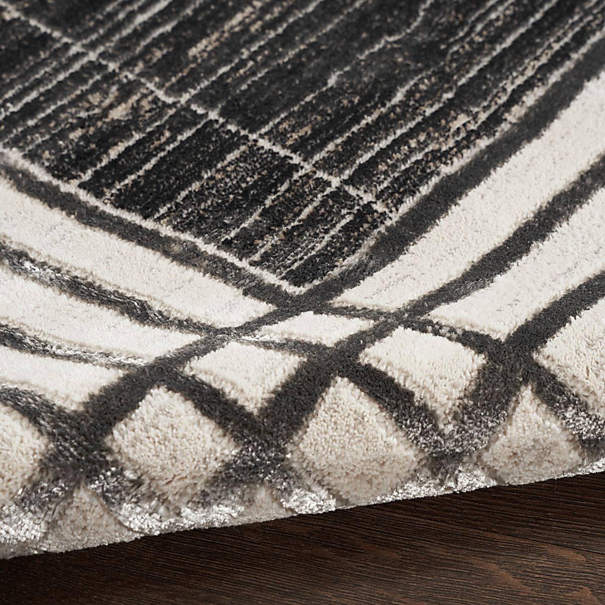 Susson Charcoal Black,Gray Rugs | Rooms to Go